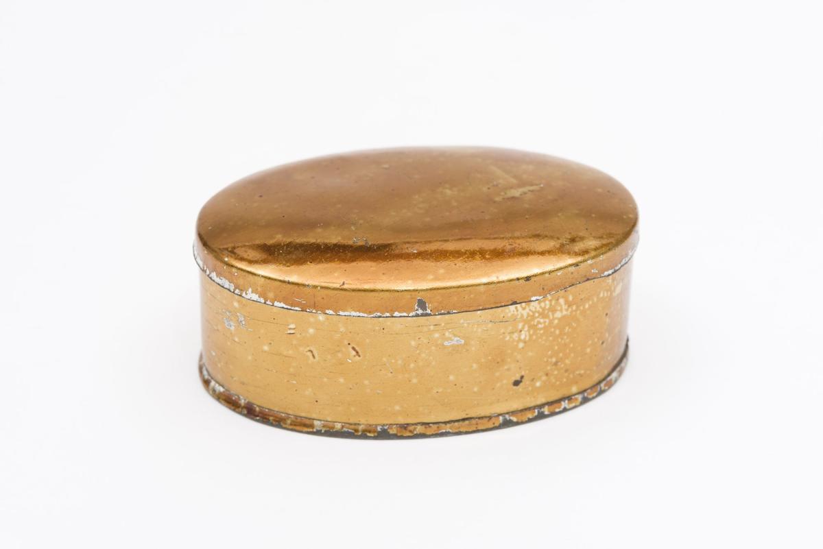 Oval golden tin with hinged lid - Faculty of Medicine, Dentistry and ...