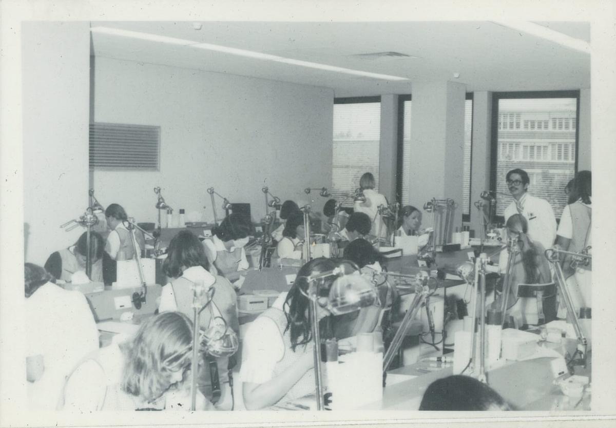 Dr Peter Cheung demonstrating restoring extracted teeth set in plaster ...